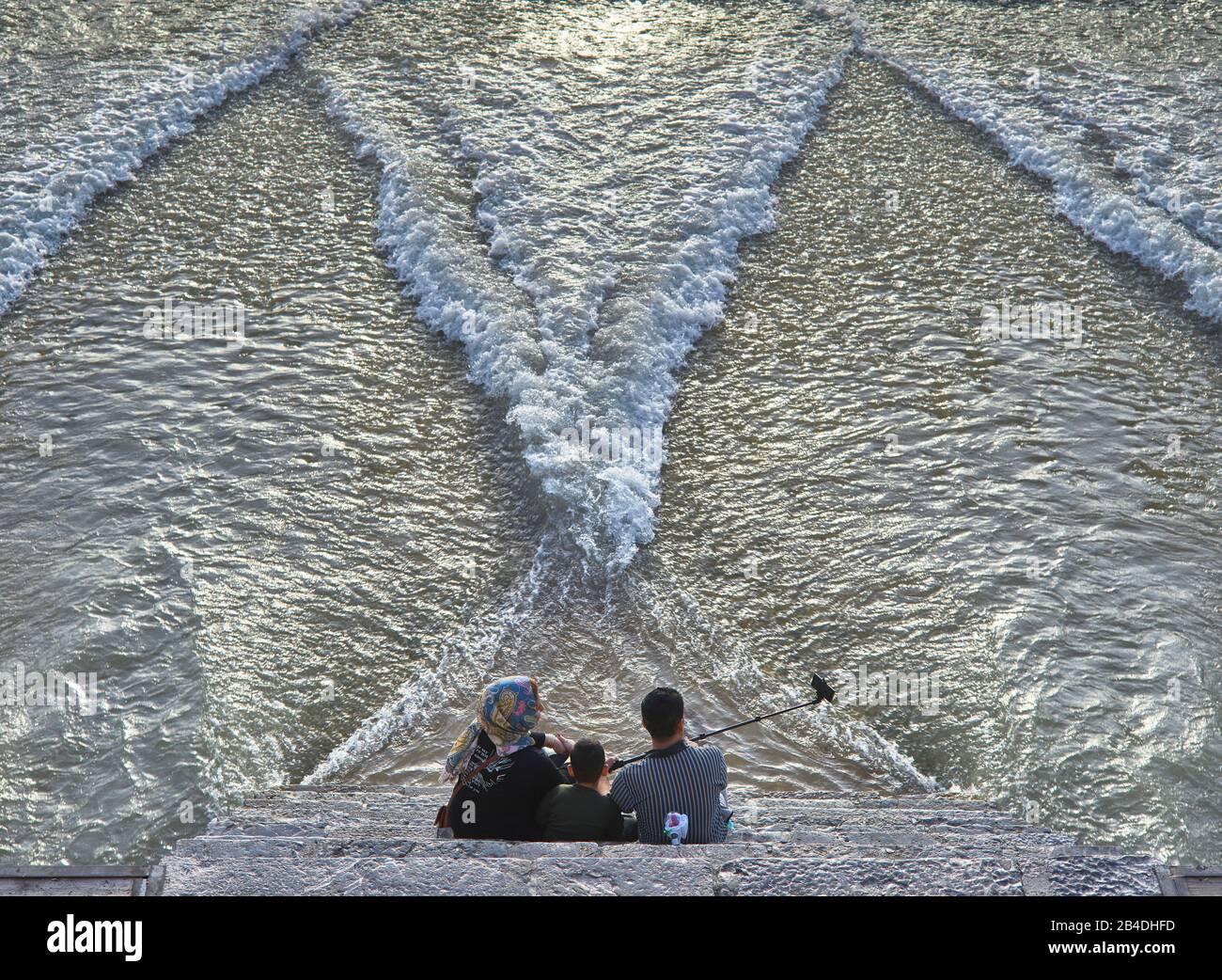 Traffic. 25th Apr, 2017. A family sits on the Khadju Bridge across the ...