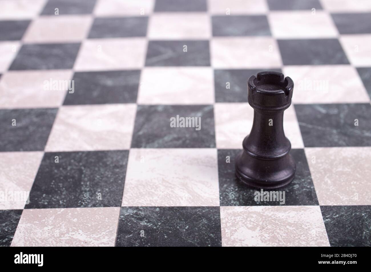 black wooden rook on chessboard Stock Photo - Alamy