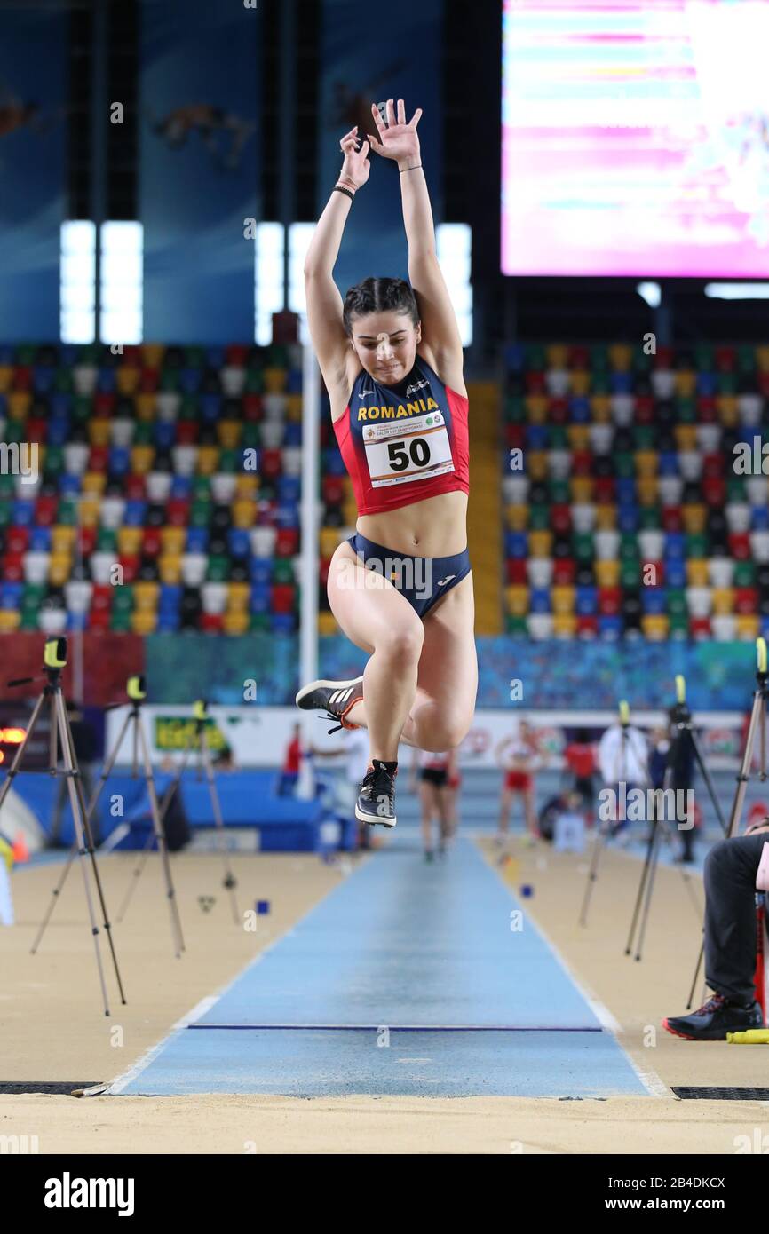 ISTANBUL, TURKEY - FEBRUARY 09, 2020: Undefined athlete long jumping ...