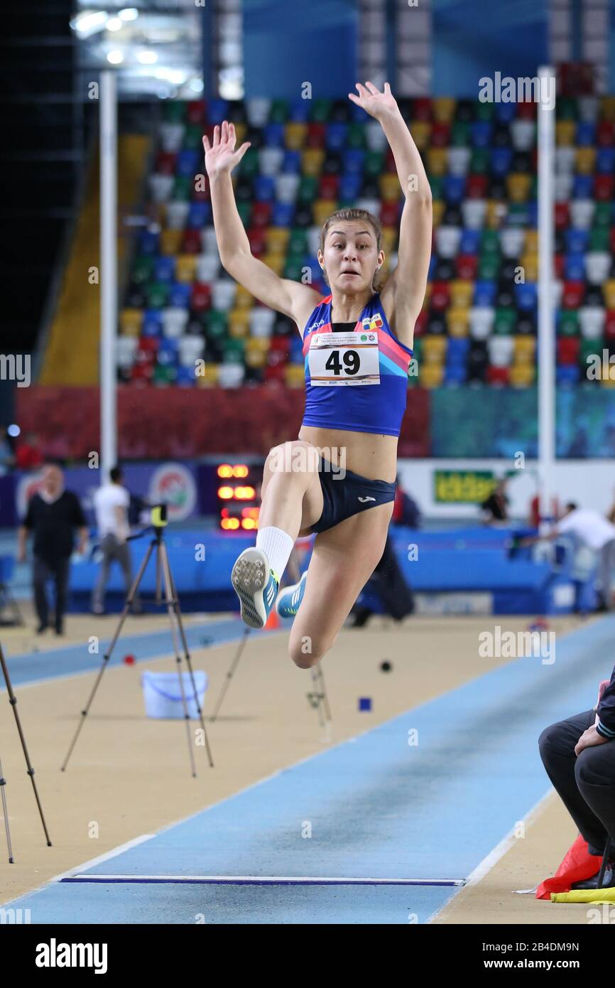 ISTANBUL, TURKEY - FEBRUARY 09, 2020: Undefined athlete long jumping ...