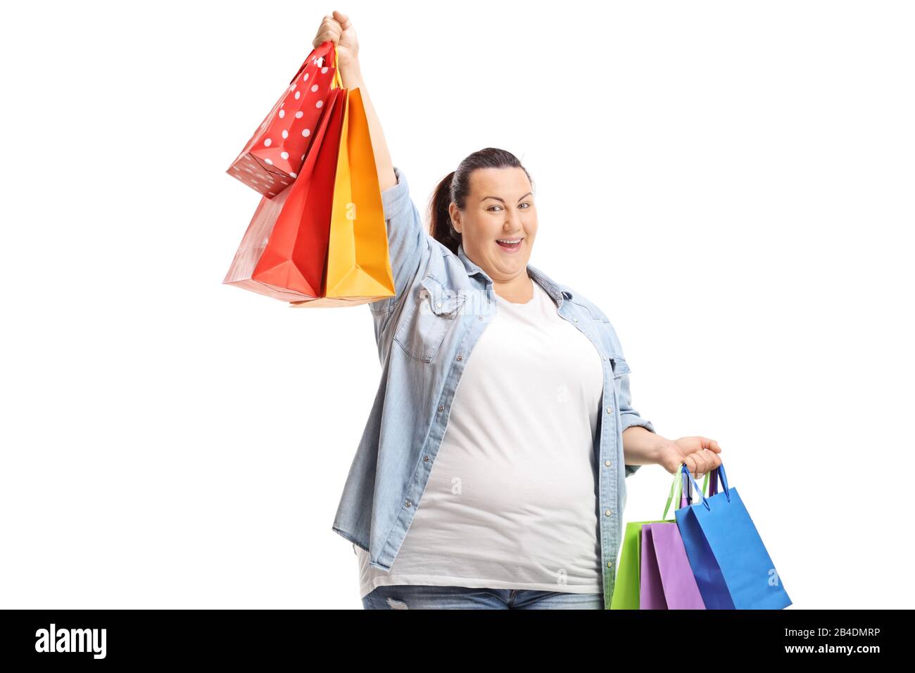 Happy overweight woman holding shopping bags isolated on white ...