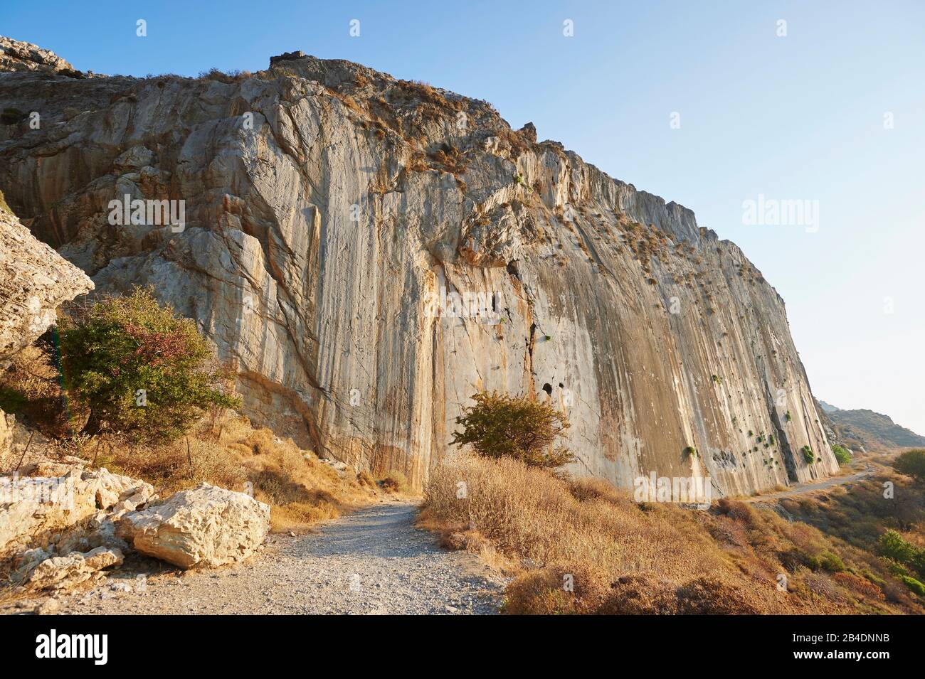 Landscape, rock wall at Paligremnos beach on the coast, vegetation ...