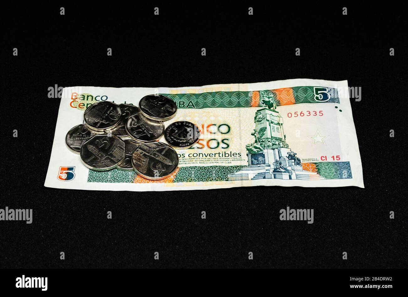 Cuban pesos and five dollar bill with a black background Stock Photo ...