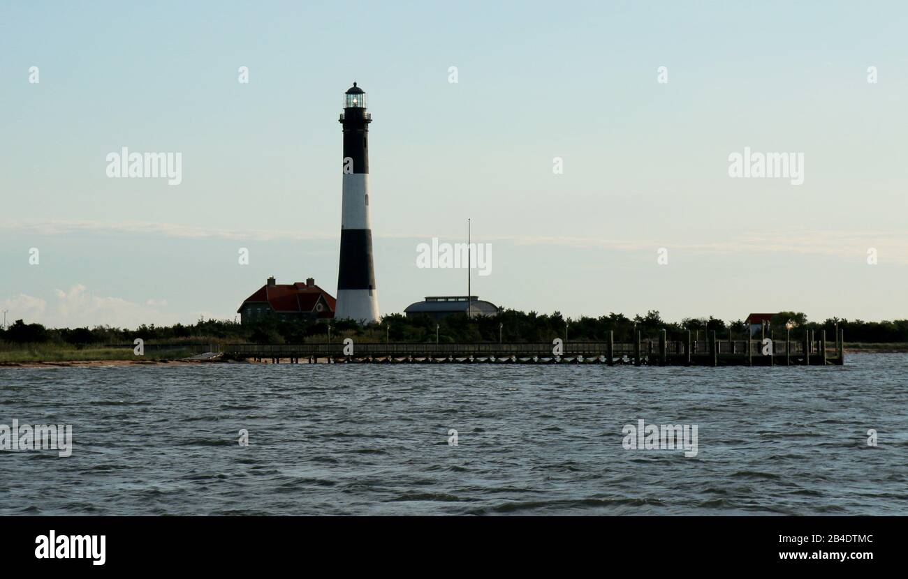 The fire island lighthouse from the bay side with their docks in the ...