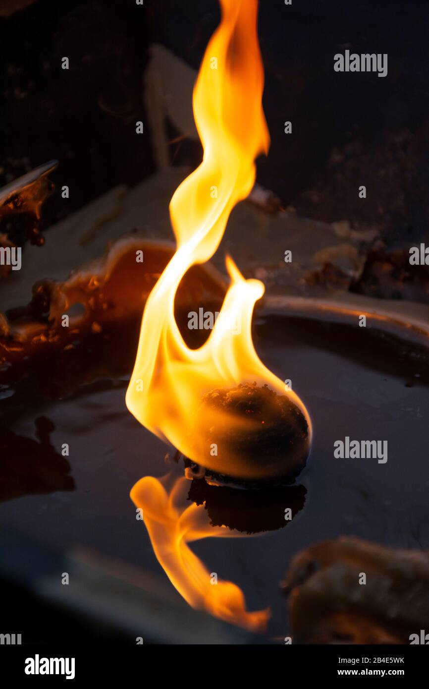 Flame on an oil bowl Stock Photo - Alamy