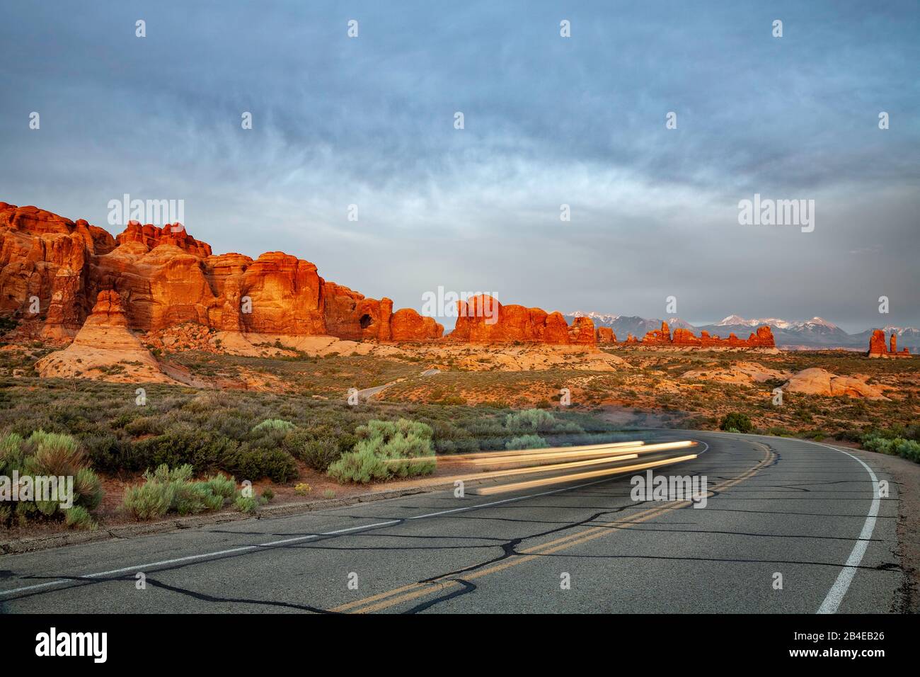 Car driving near the Garden of Eden, Arches National Park, Utah USA ...