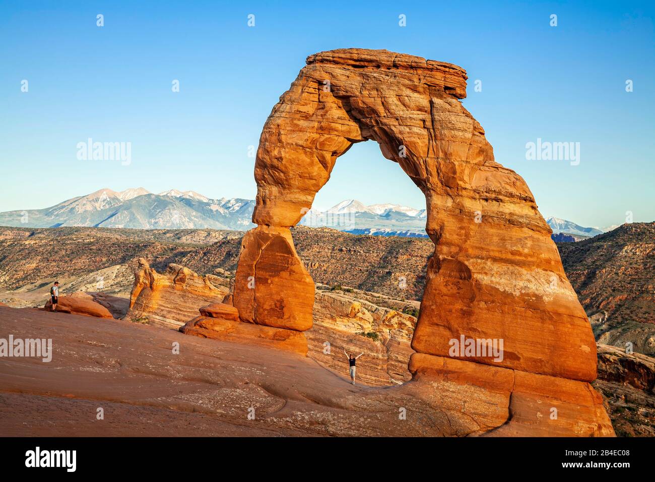 Tourists under delicate arch hi-res stock photography and images - Alamy