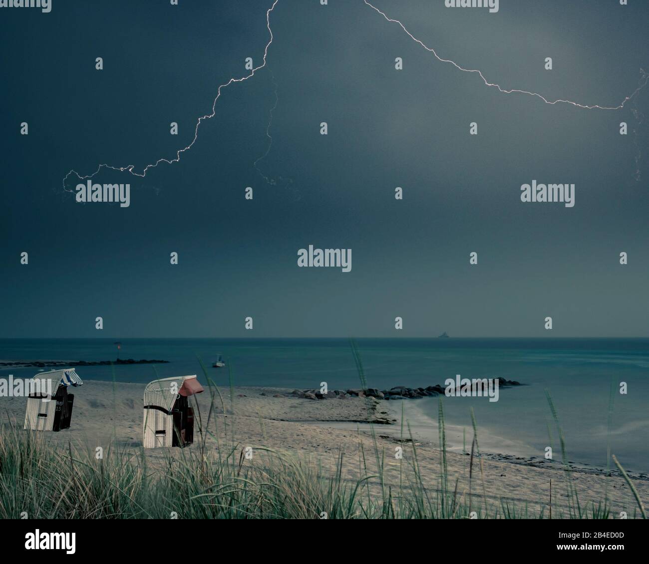 Cloud lightning over Baltic sea beach with beach chairs Stock Photo - Alamy