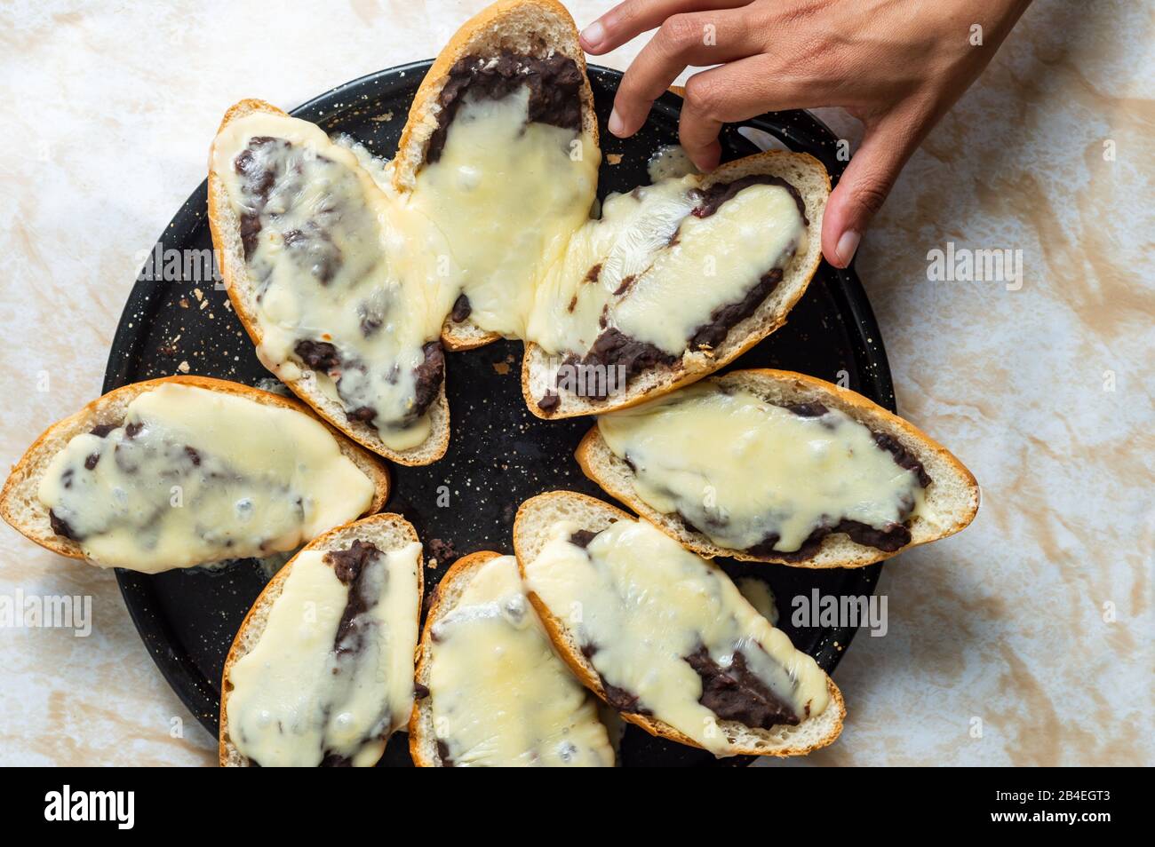 Molletes. Vegetarian Mexican food similar to bruschetta. Refried beans ...