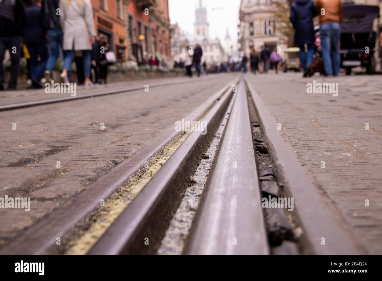 The tramway rails in the middle of the old cobblestone in the midle of ...