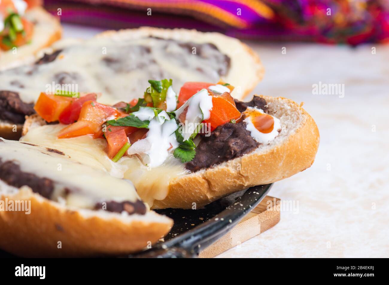 Molletes. Vegetarian Mexican food similar to bruschetta. Refried beans ...