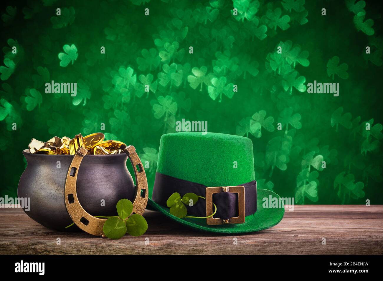 St Patrick's Day hat and pot with gold coins on green twinkling bokeh ...
