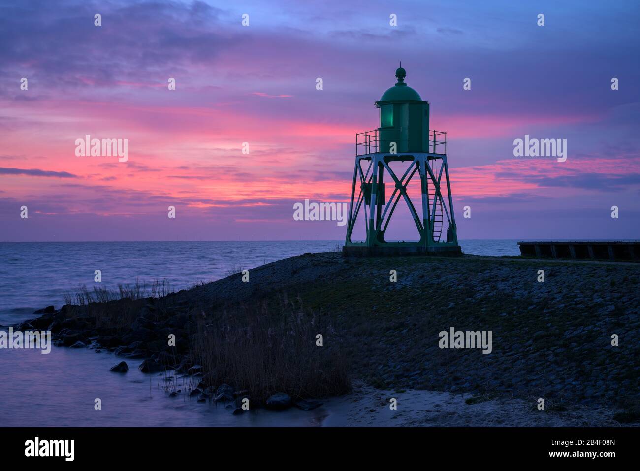 Stavoren lighthouse at sunset Stock Photo - Alamy
