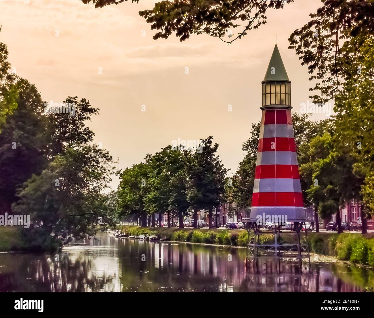 Canal with lighthouse in valkenberg park Breda, Beautiful urban scenery ...