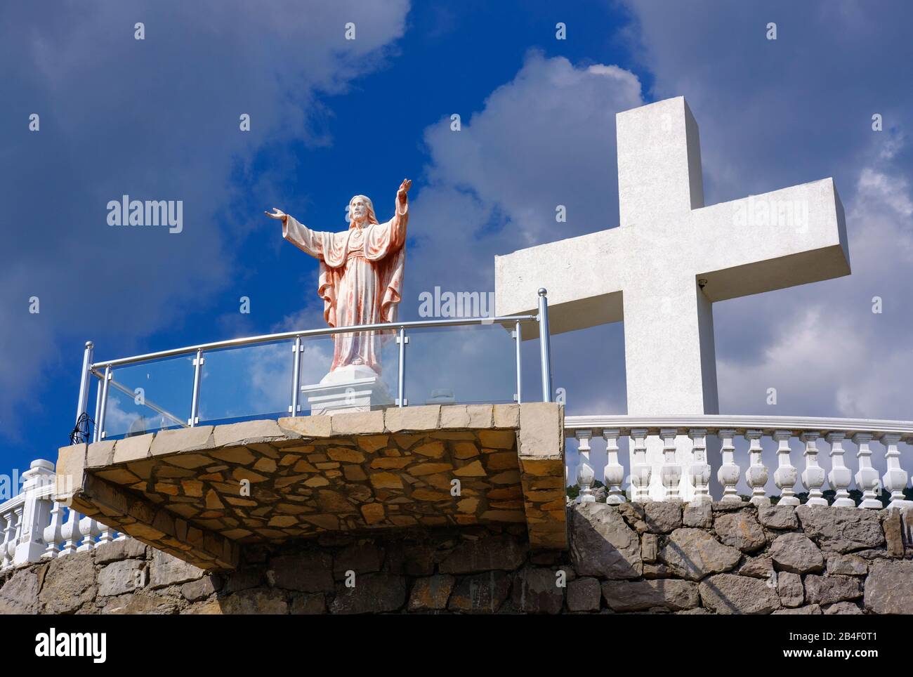 Christ statue and cross in Delaj, at Podgorica, Montenegro Stock Photo ...