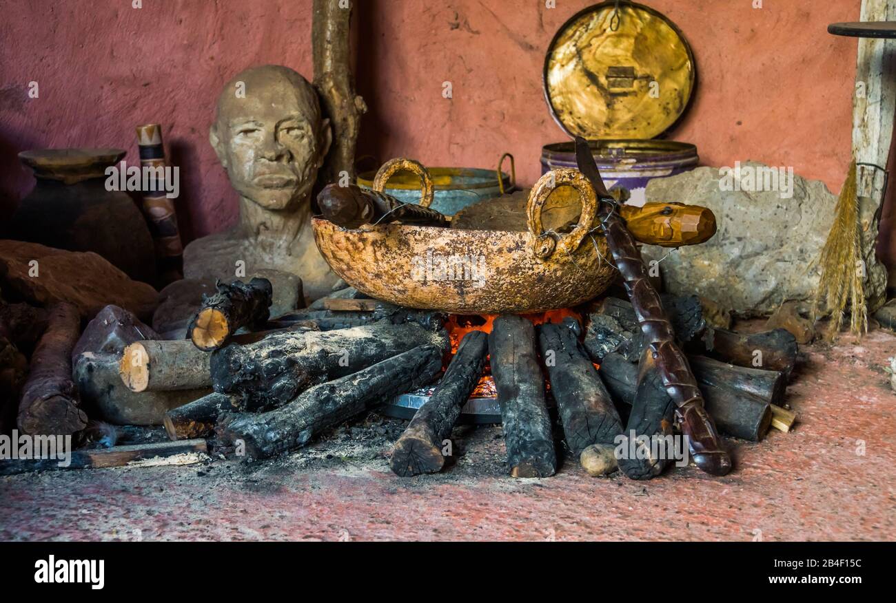 historical fire place, old cooking equipment, primitive kitchen with ...