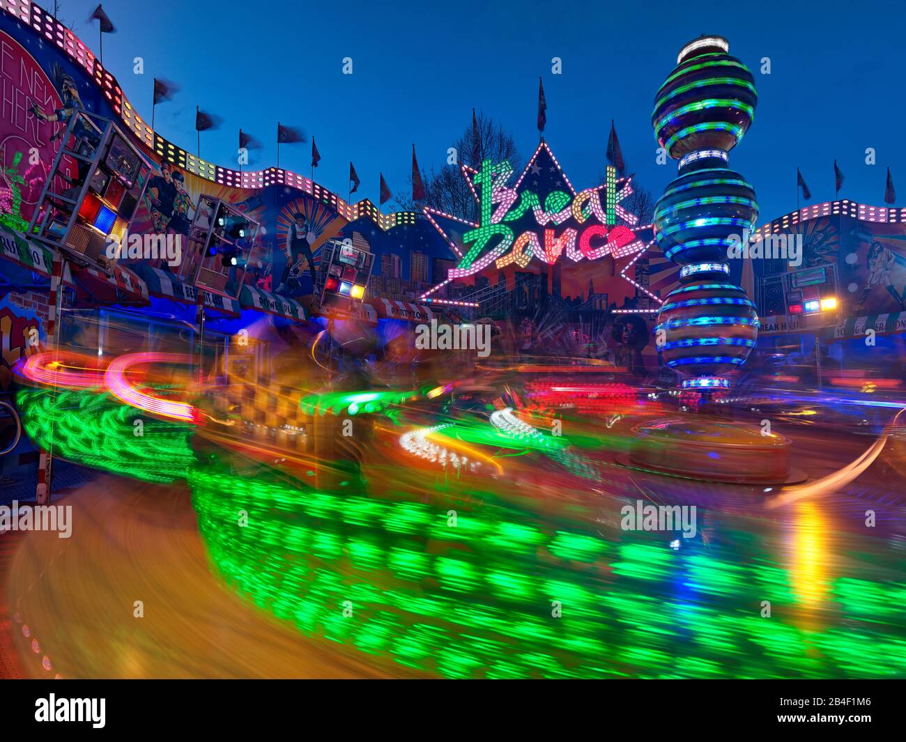 Folk festival, fair, rides, light trails, chain carousel Stock Photo ...