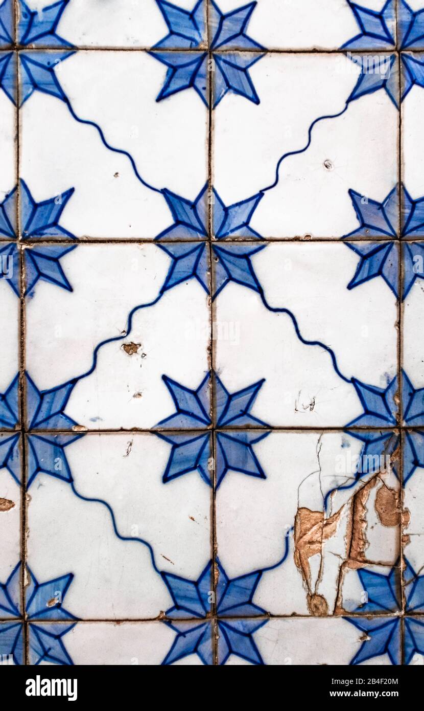 Dilapidated Portuguese traditional tiles Azulejos with blue floral ...