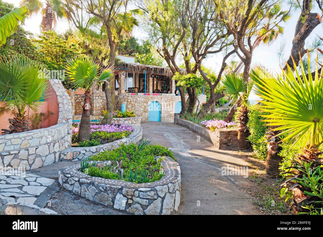 Rustic stone walls in the driveway of the campsite Aginara Beach ...