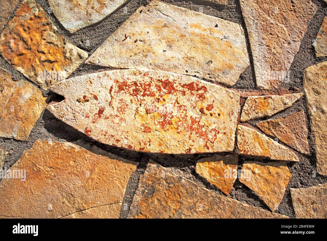 Rock-shaped fish in a wall, Greece Stock Photo - Alamy