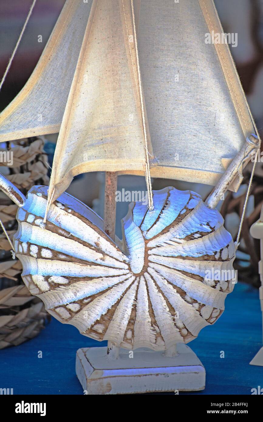 Sailing ship made of stylized ammonite shell as decoration souvenir hi ...