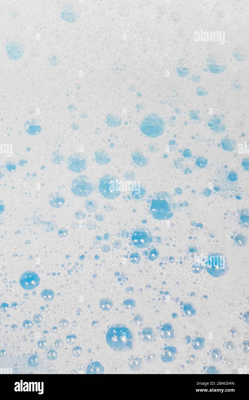 White foam with small bubbles popping in blue water Stock Photo - Alamy