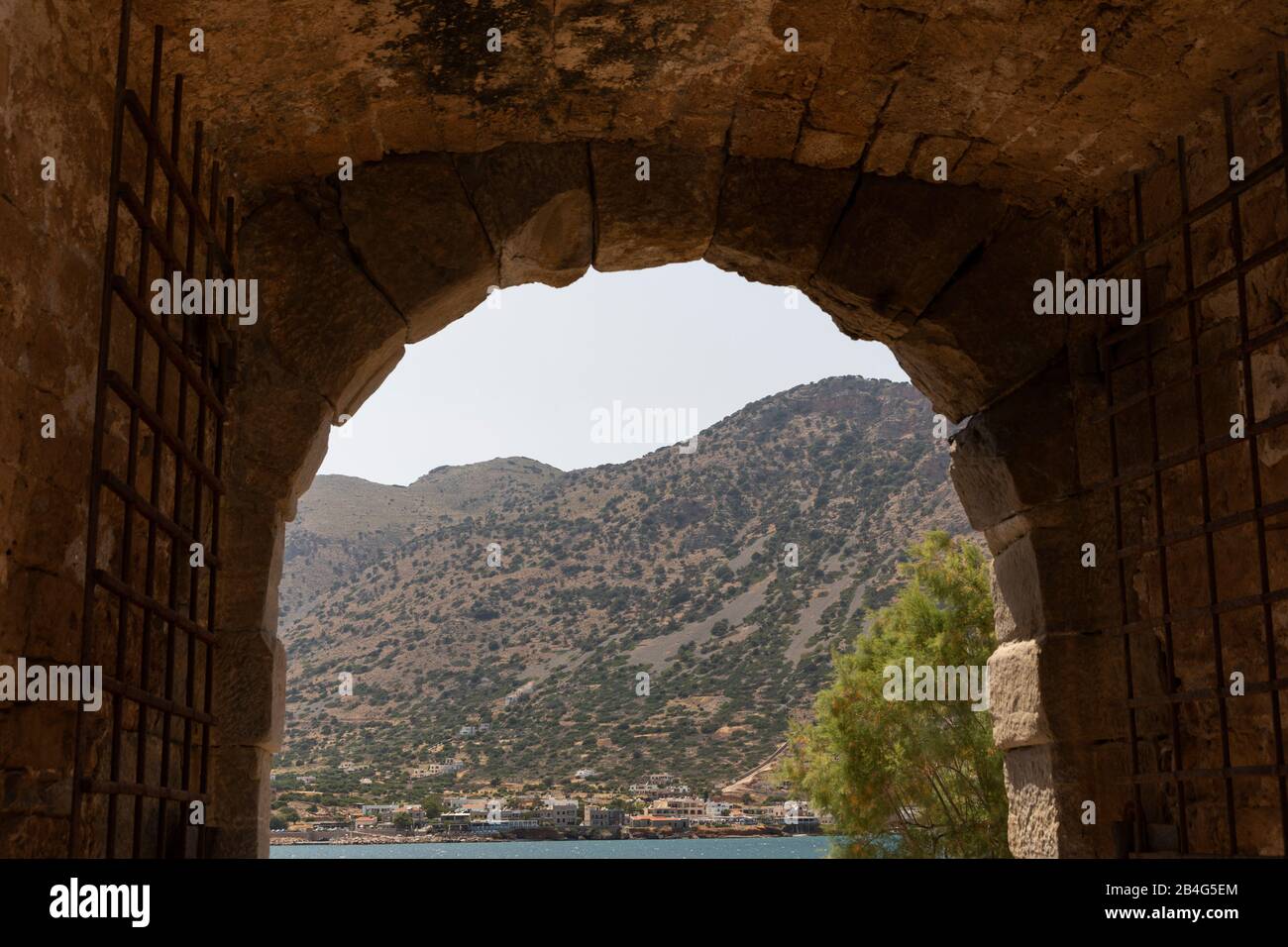 View through the entrance gate from the leprosy island Spinalonga to ...