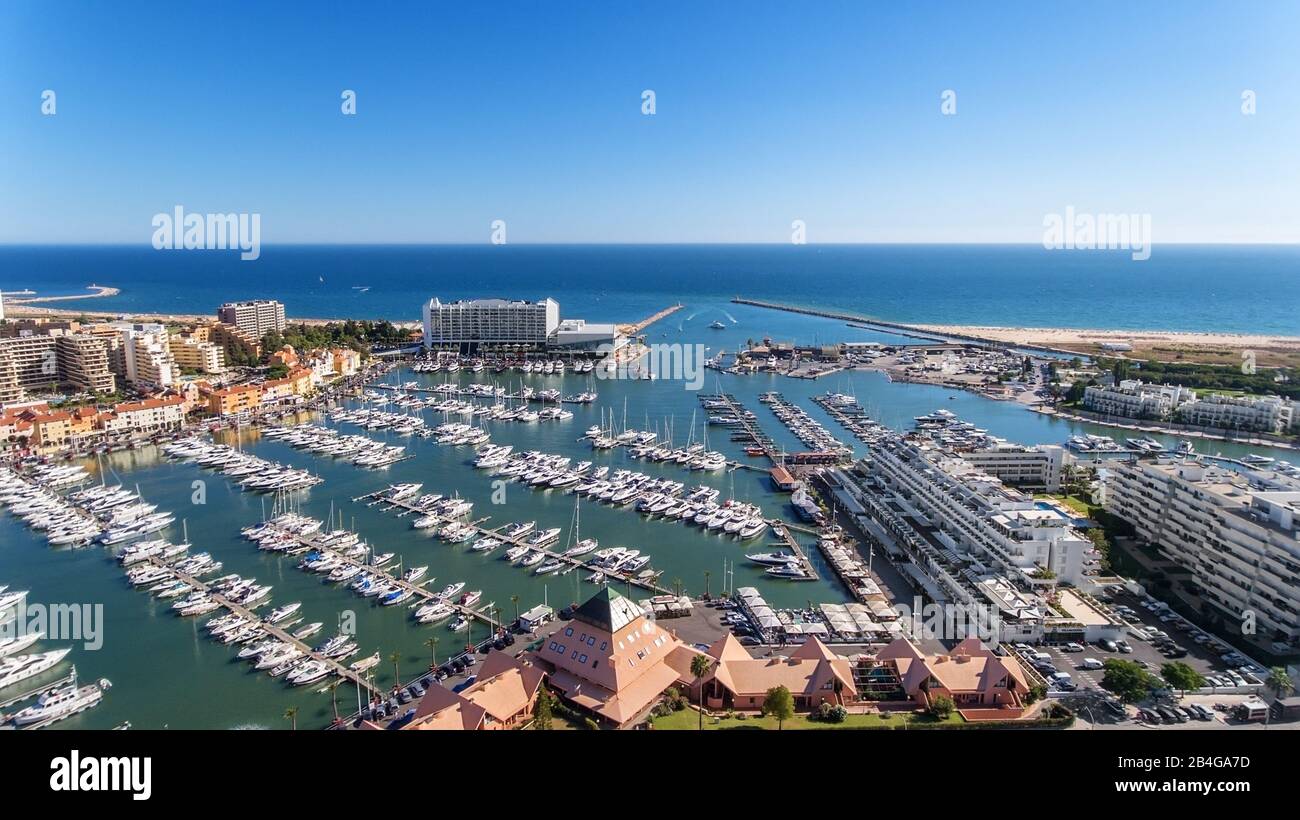 Aerial view of the bay of the marina, with luxury yachts in Vilamoura ...