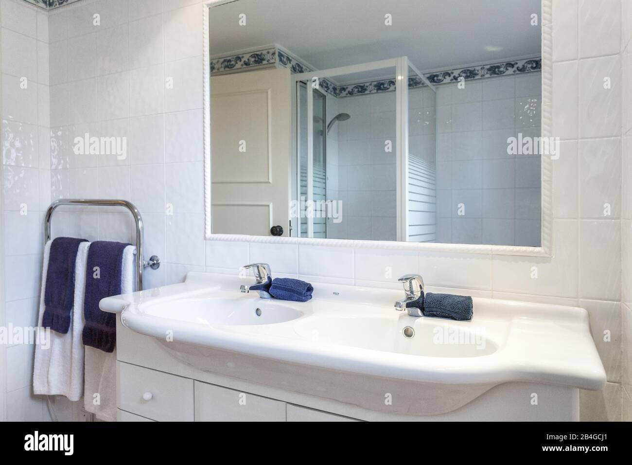 Washbasin and mirror with reflection of the shower. Modern bathroom ...
