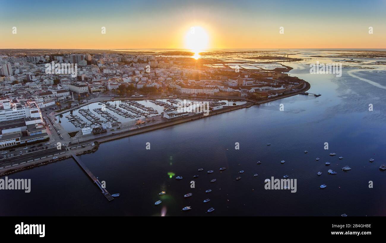 Aerial view of the sunrise over the city of Faro, Portugal. Marina ...