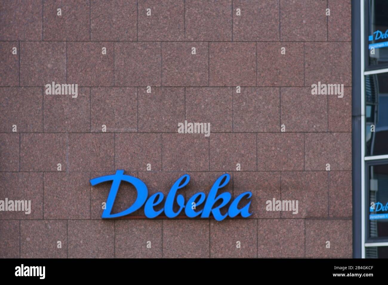 The logo of Bauspar insurance Debeka on the facade of a business ...
