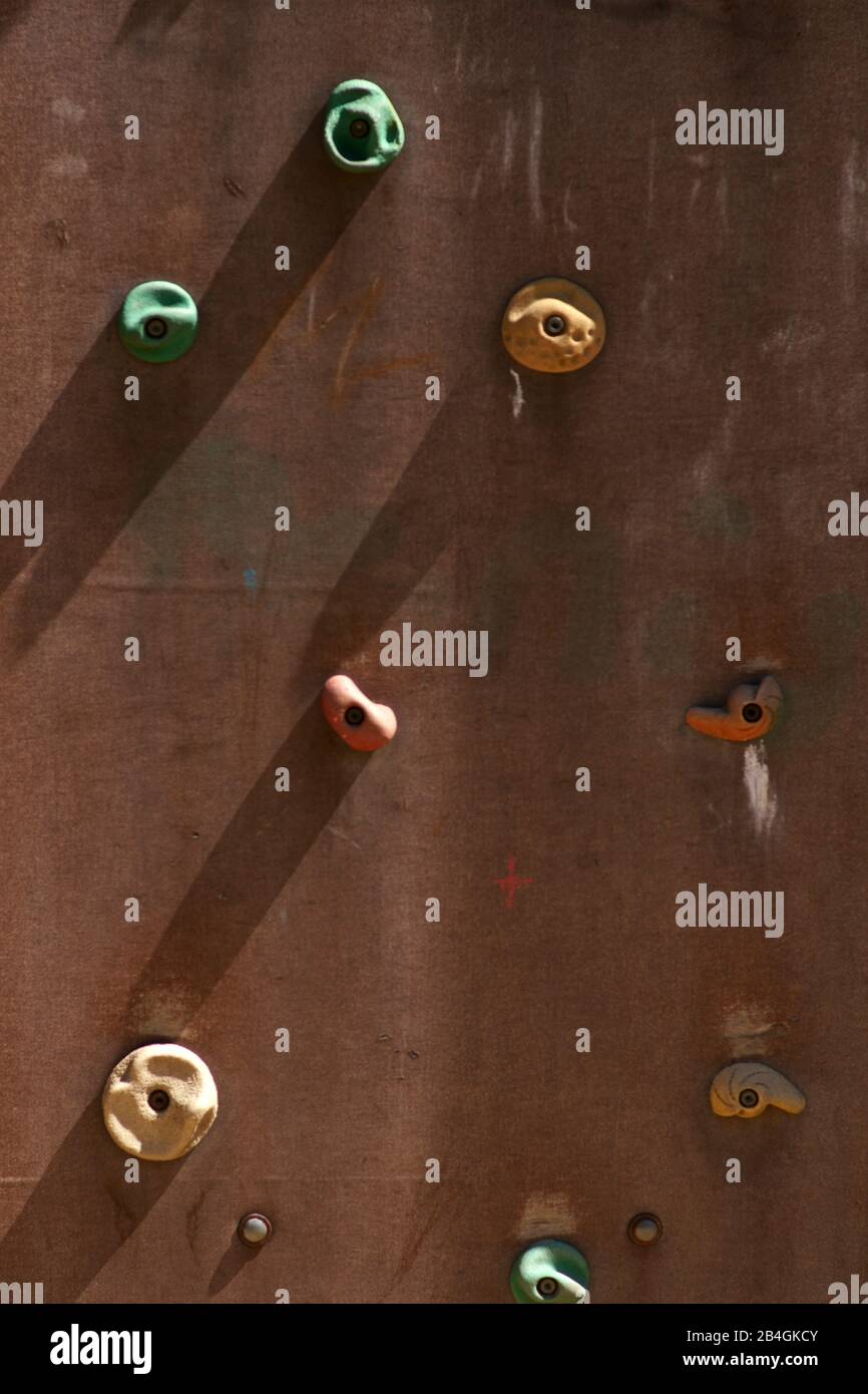 The close up view of a climbing wall with rubber rungs hi-res stock ...