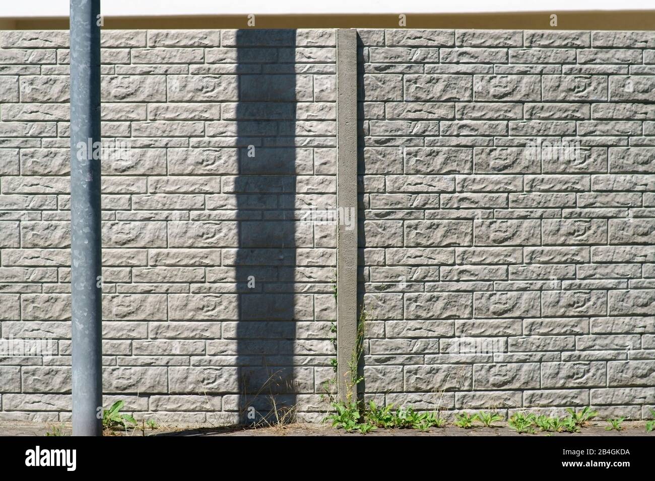 Lamp post shadow against wall of striking bright hi-res stock ...