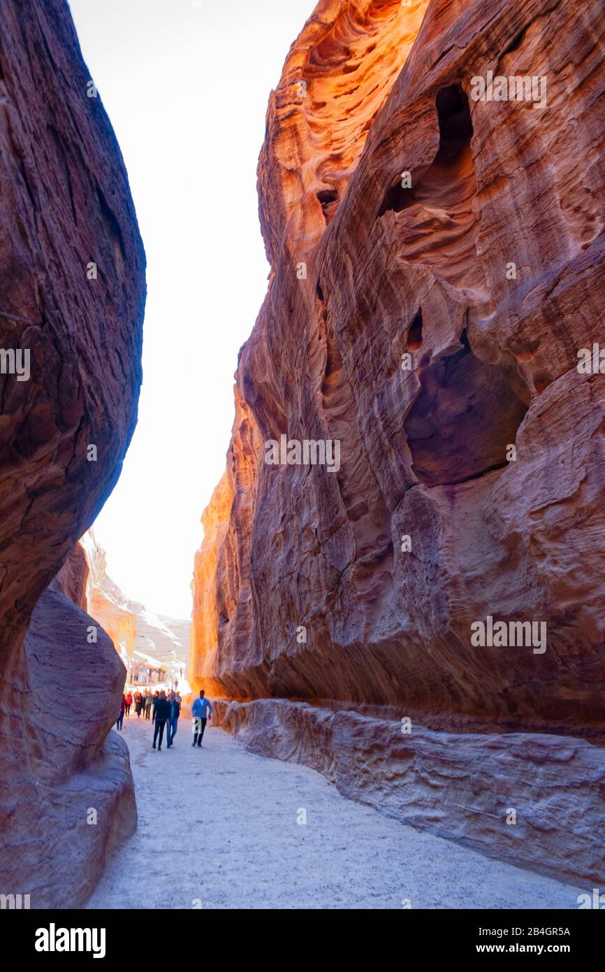 Jordan, rock city Petra, valley cut, tourists Stock Photo - Alamy
