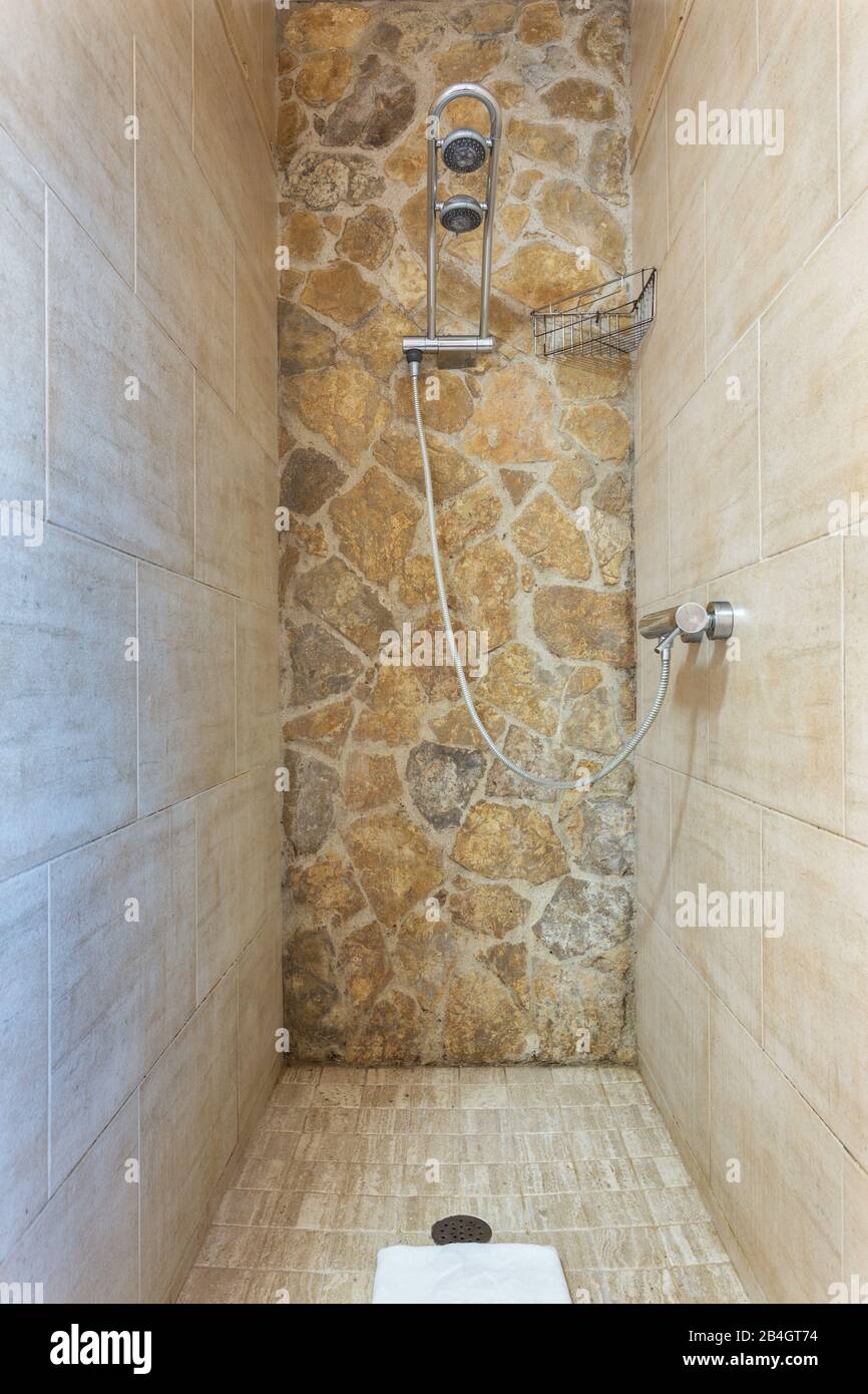 The shower cubicle is made of mountain decorative stone Stock Photo - Alamy