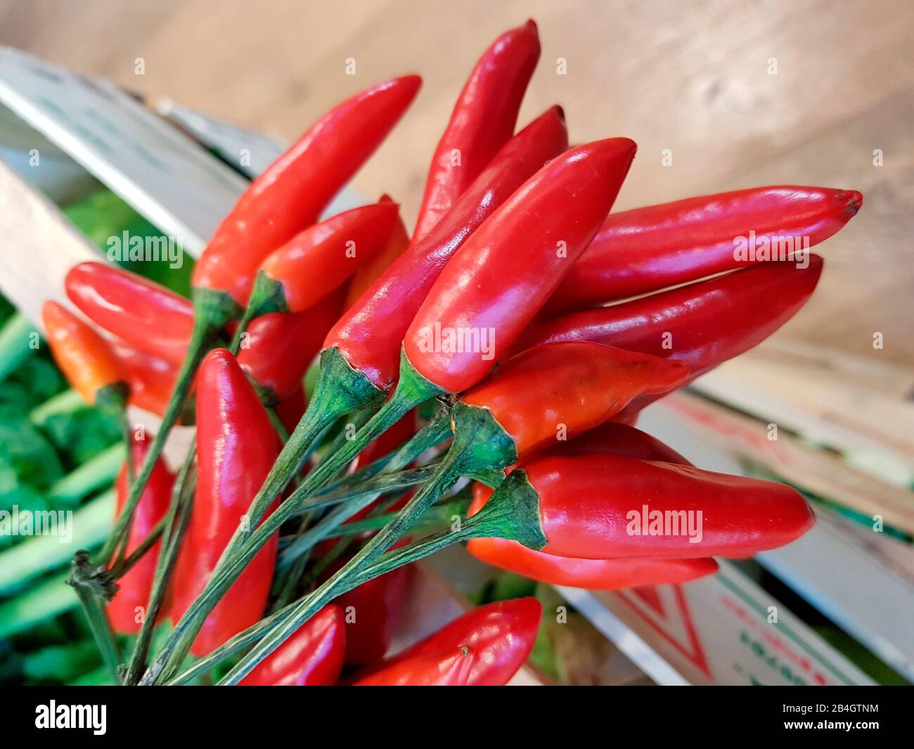 Chili in the box Stock Photo - Alamy
