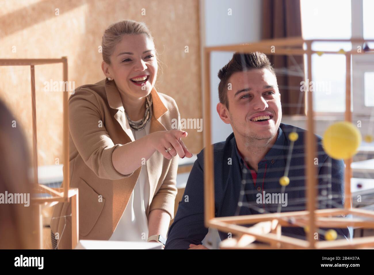 Female Architecture teacher at work. Female professor explain ...