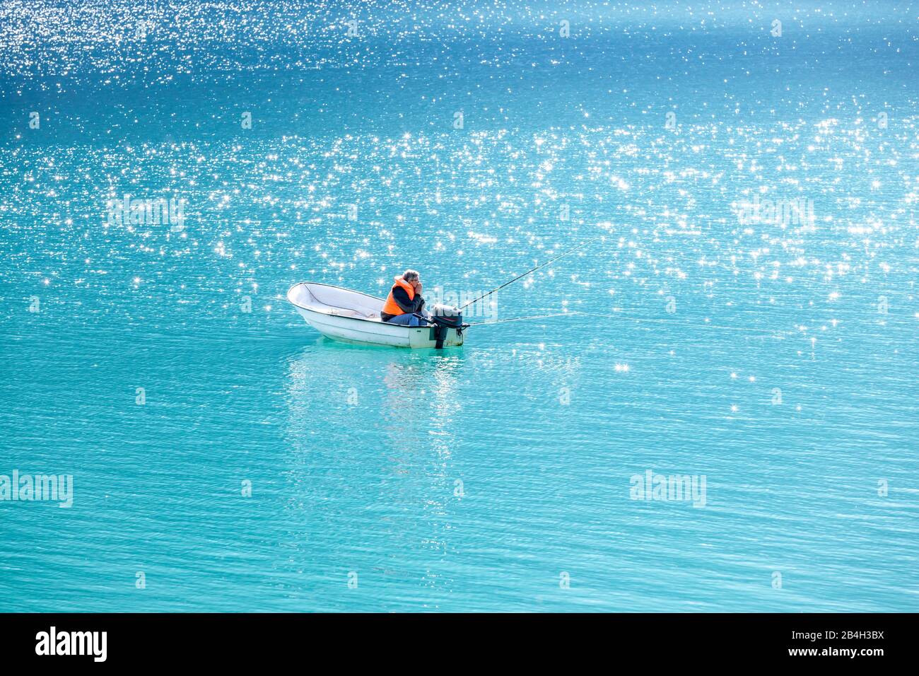 Sport angler in his boat Stock Photo - Alamy
