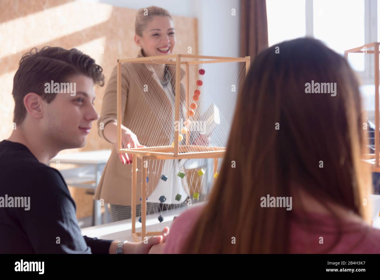 Female Architecture teacher at work. Female professor explain ...