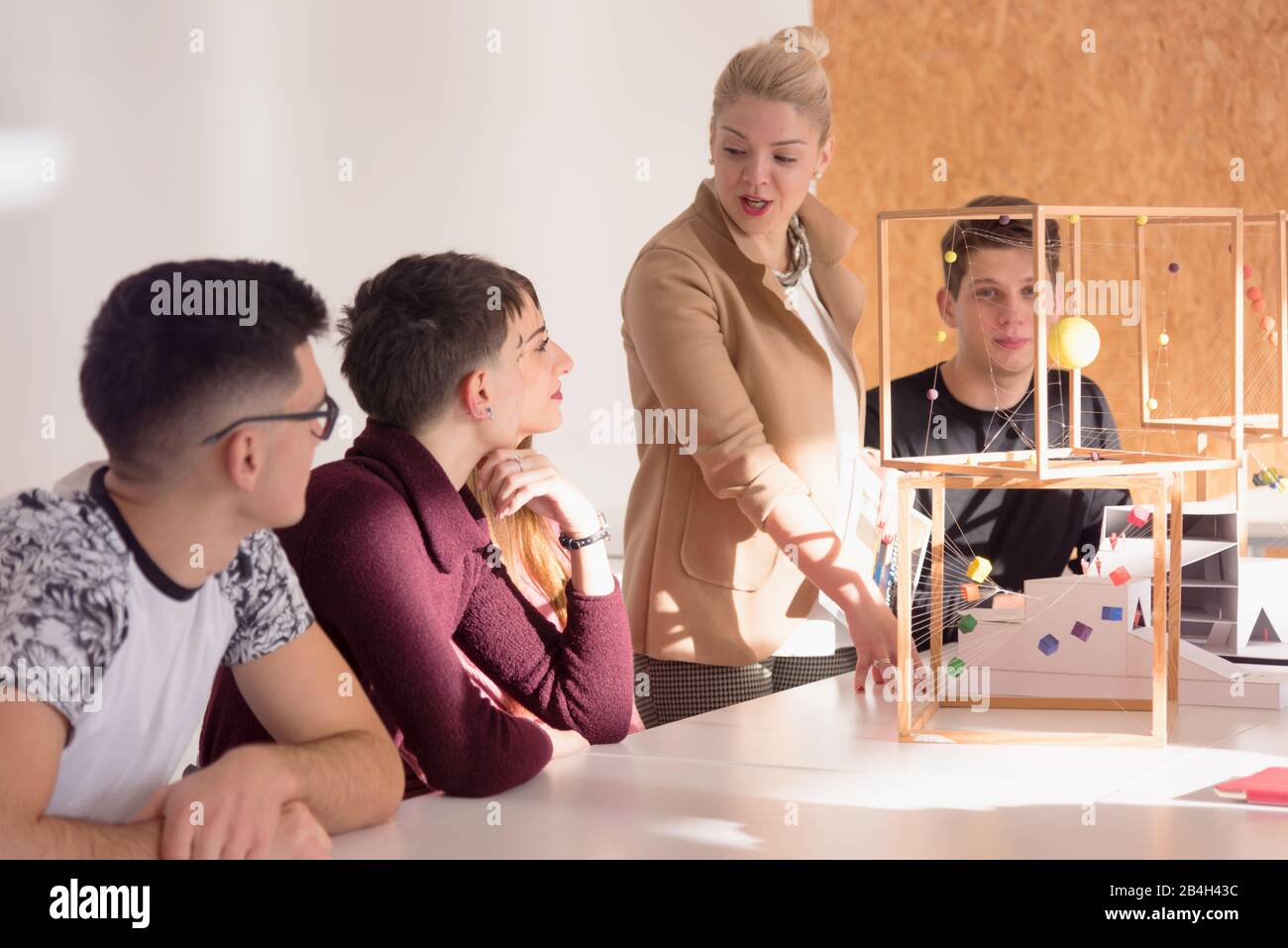 Female Architecture teacher at work. Female professor explain ...