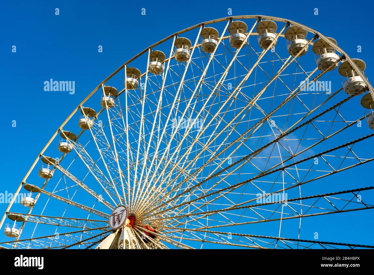 Ferris wheel, with open gondolas, blue sky, on the castle square in ...