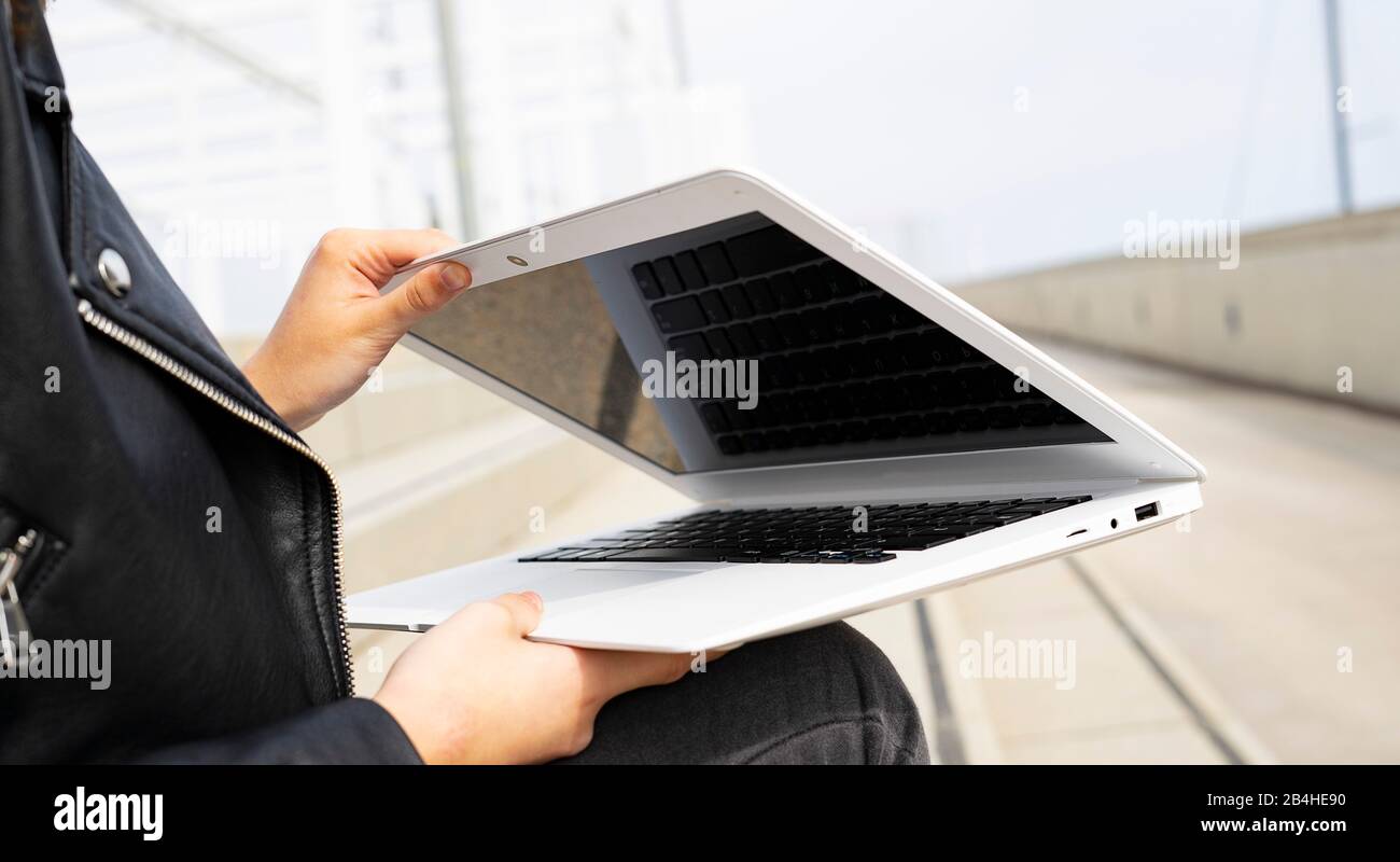 Woman closing her white laptop. Concept of Closing laptop Stock Photo ...