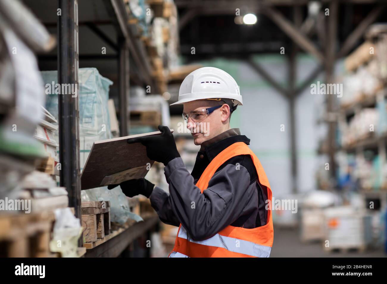 warehouse worker male working in a store Stock Photo - Alamy
