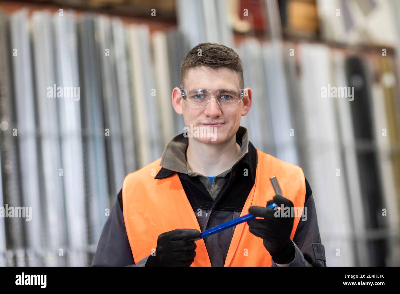 technician male with a tool working in a store Stock Photo - Alamy