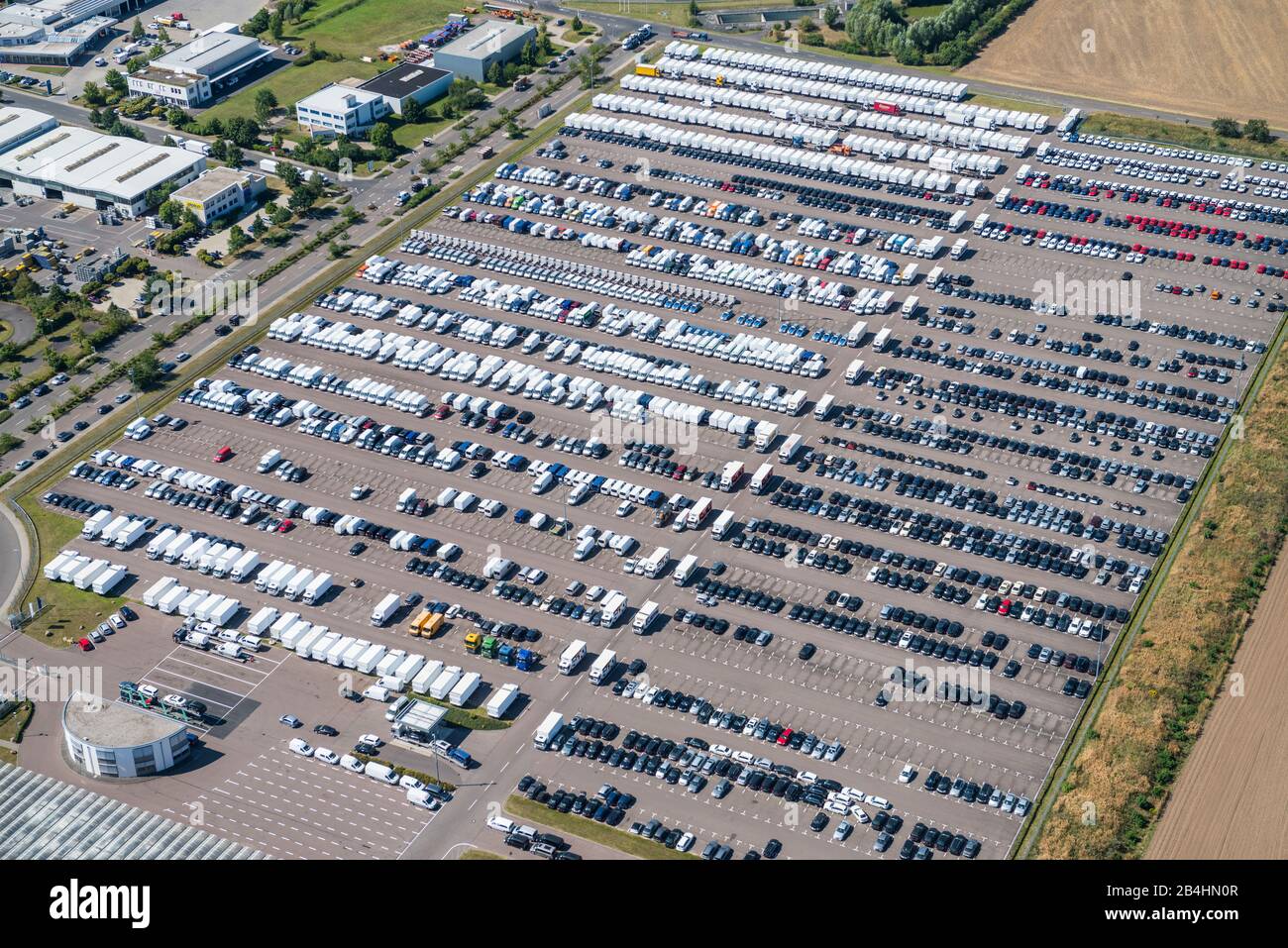 Aerial view of large parking lot, assorted colors Stock Photo - Alamy