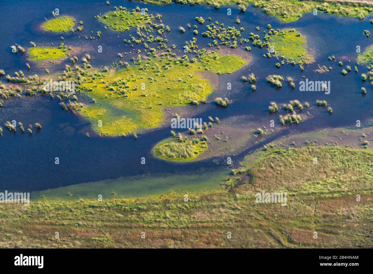 Aerial view of a lake full of algae with an exciting play of colors ...