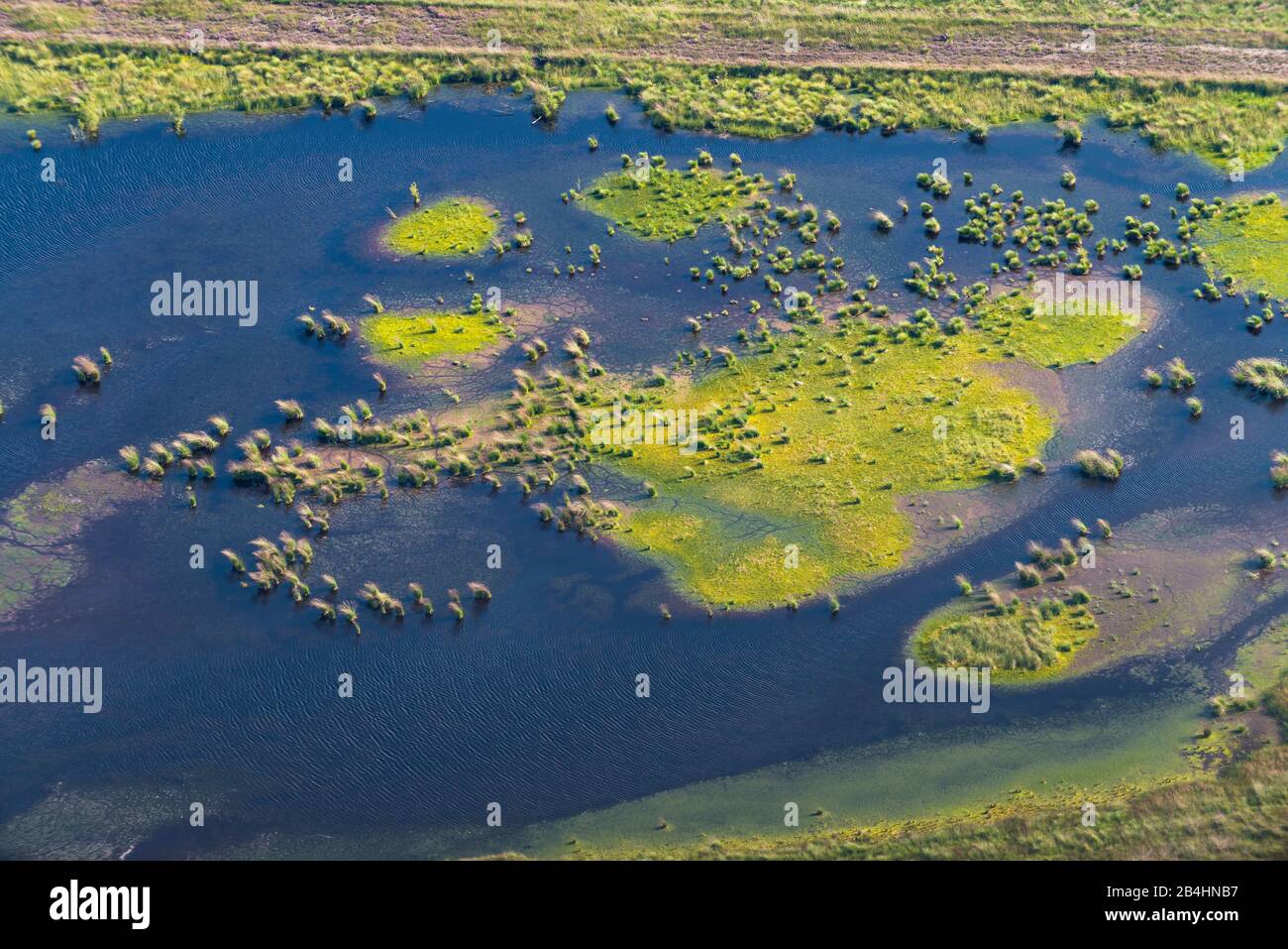 Aerial view of a lake full of algae with an exciting play of colors ...