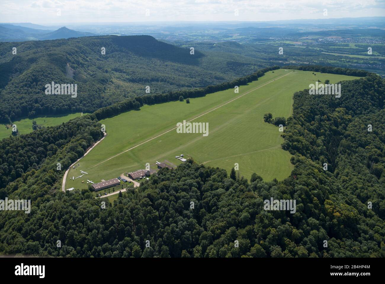 Aerial view of an airfield for sport planes and gliders in the forest ...