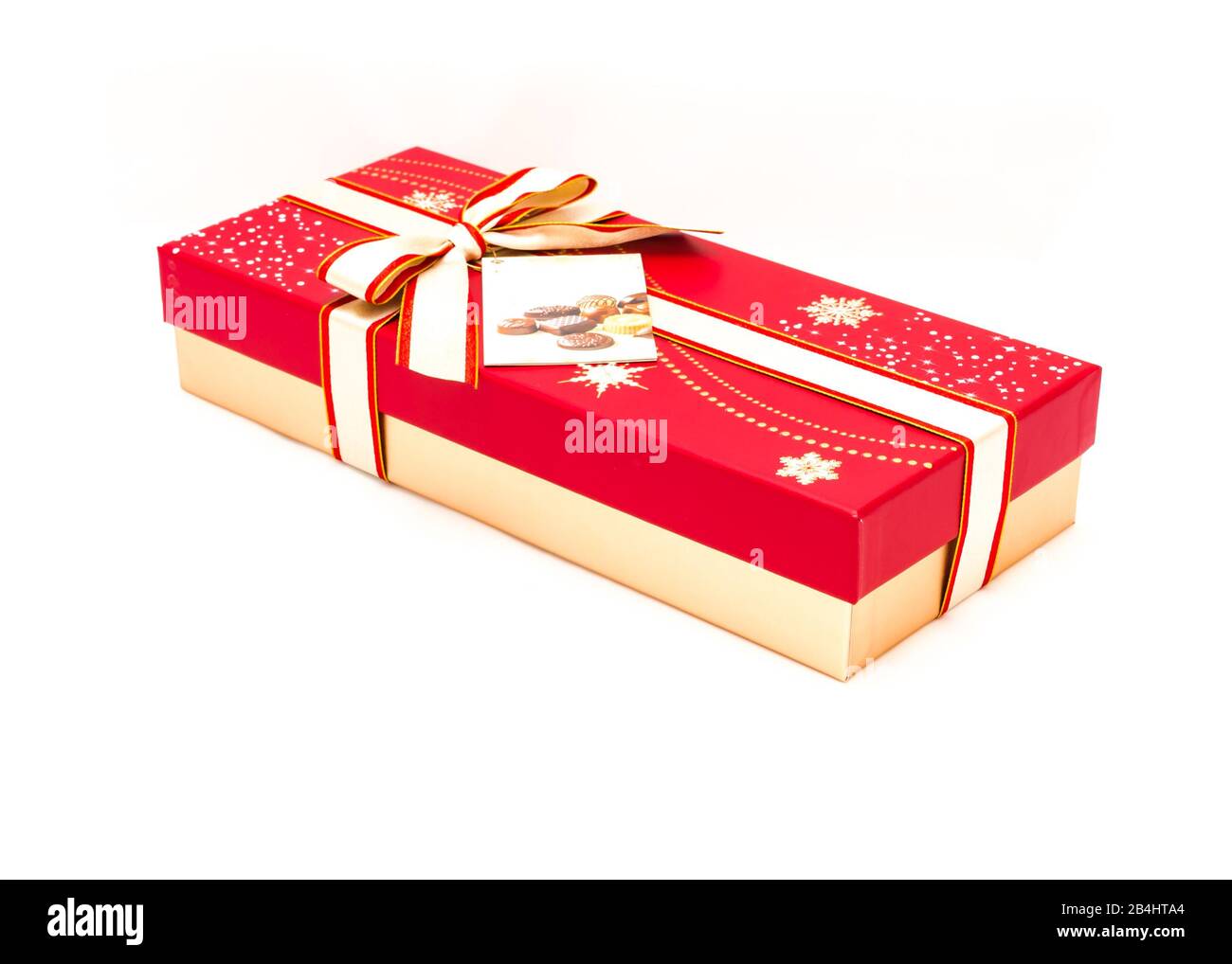Red chocolate box with tag label and red yellow bow ribbon isolated on ...