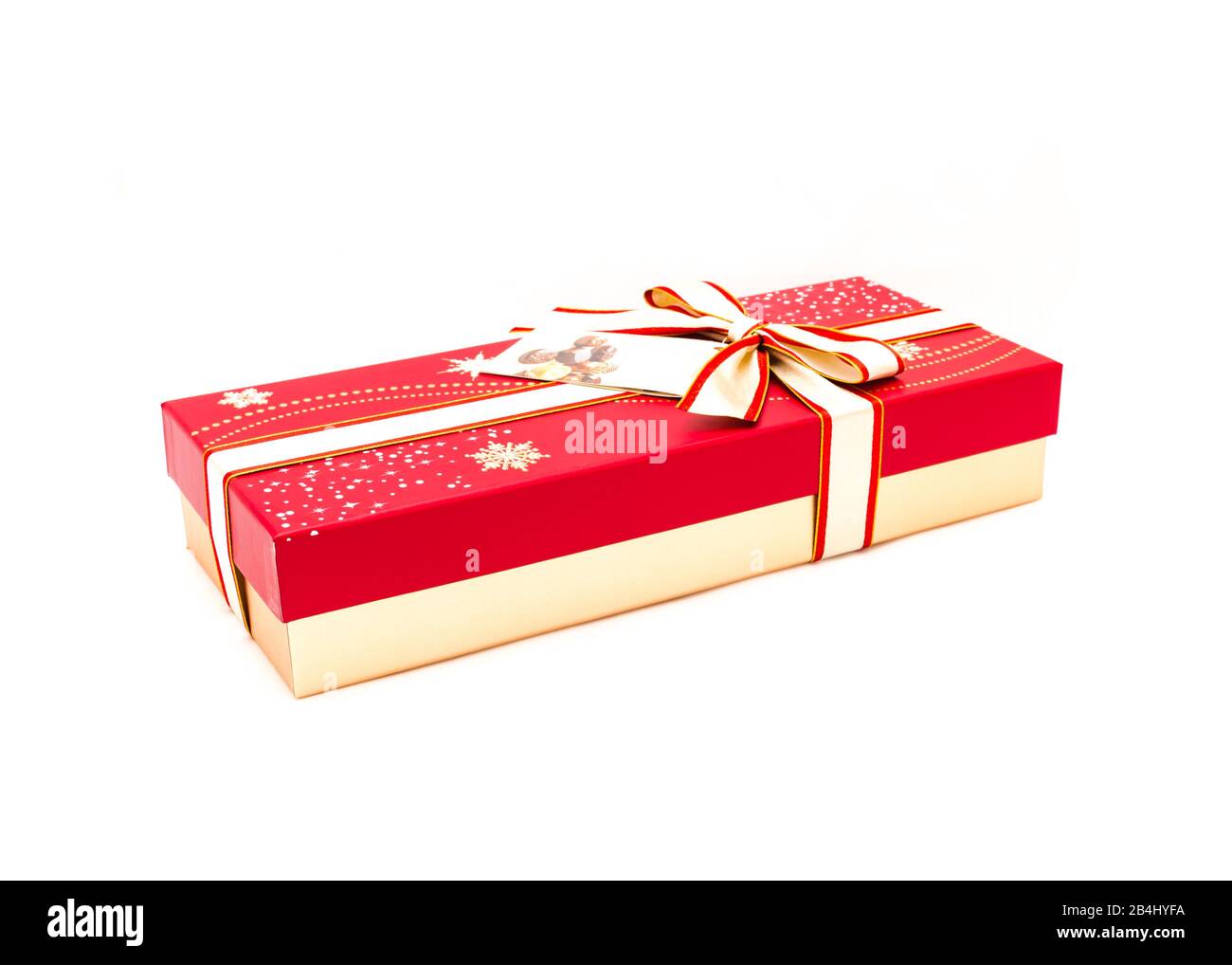 Red chocolate box with tag label and red yellow bow ribbon isolated on ...
